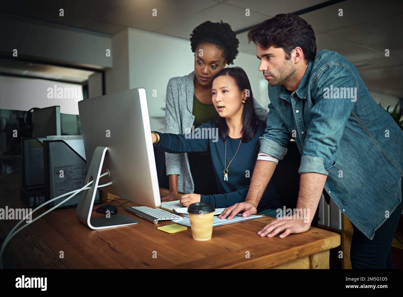 Pointing them in the right direction. three young designers working in ...