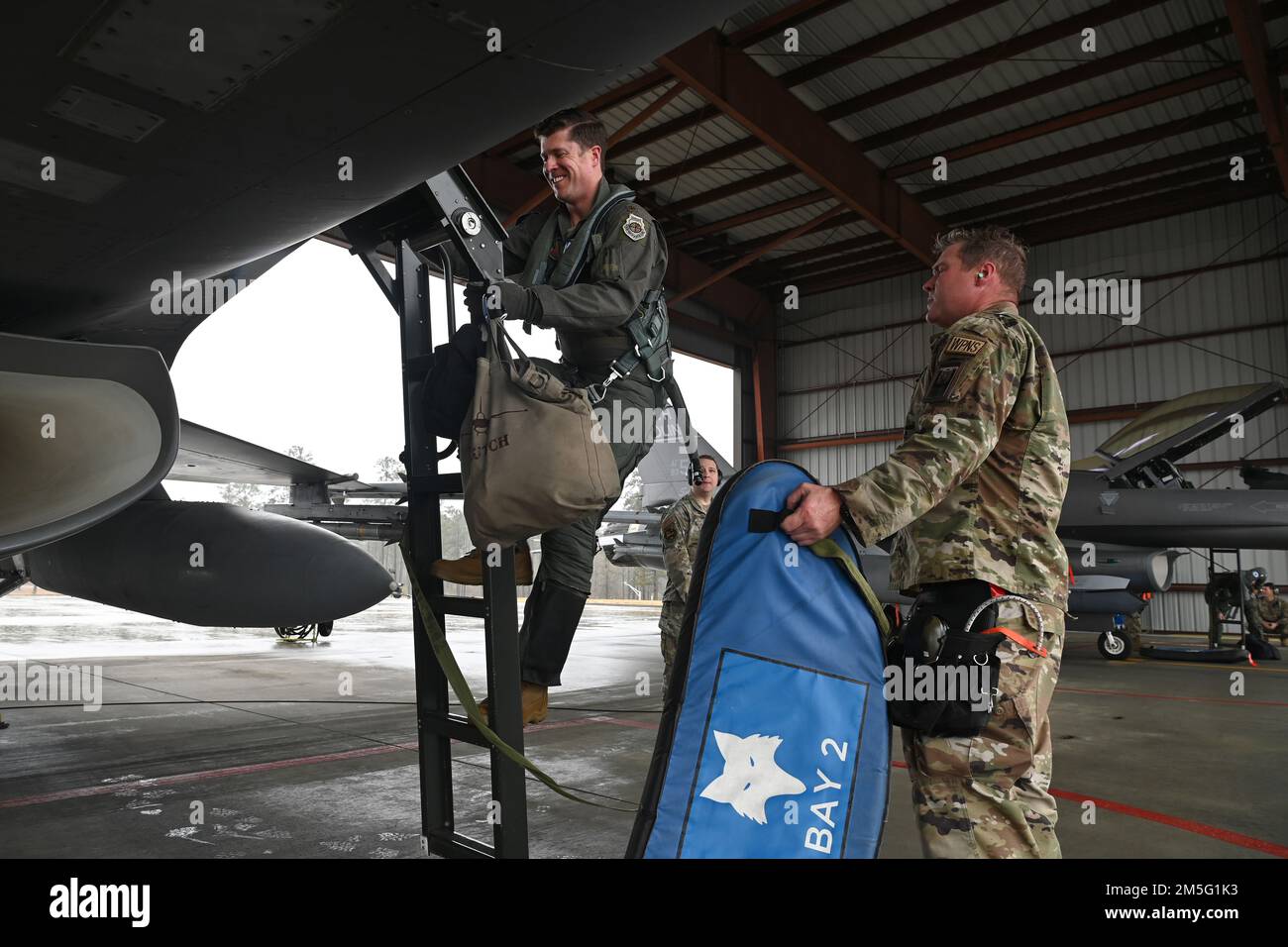 U.S. Air Force Maj. Shaun Hoeltje, left, and Tech. Sgt. William Harris ...