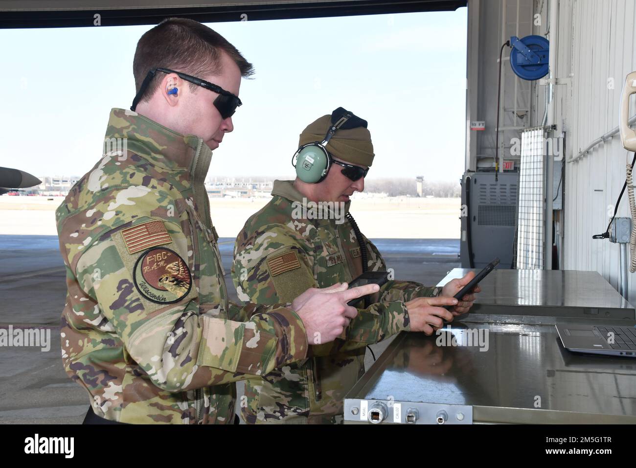 U.S. Air Force Staff Sergeants Nathan White, left, and Donovan Halajian ...
