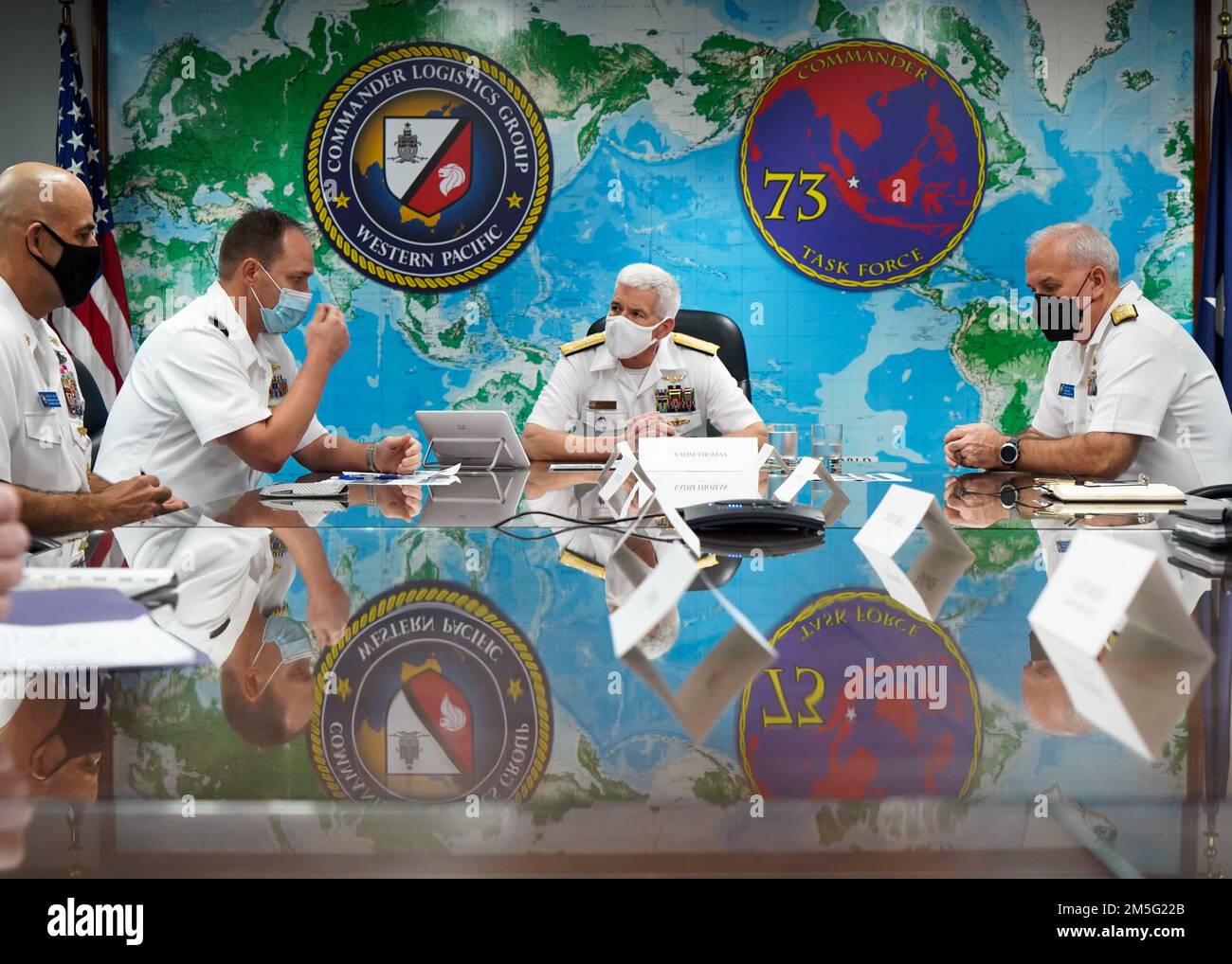 220316-N-JC800-0005 SINGAPORE (MAR. 16, 2022) – (From left) Command Master Chief Jonathon Carter ...