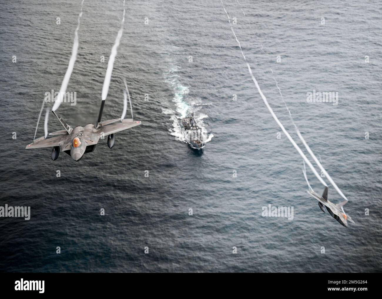 U.S. Air Force F-22 Raptors, assigned to Alaska NORAD Region, fly over ...