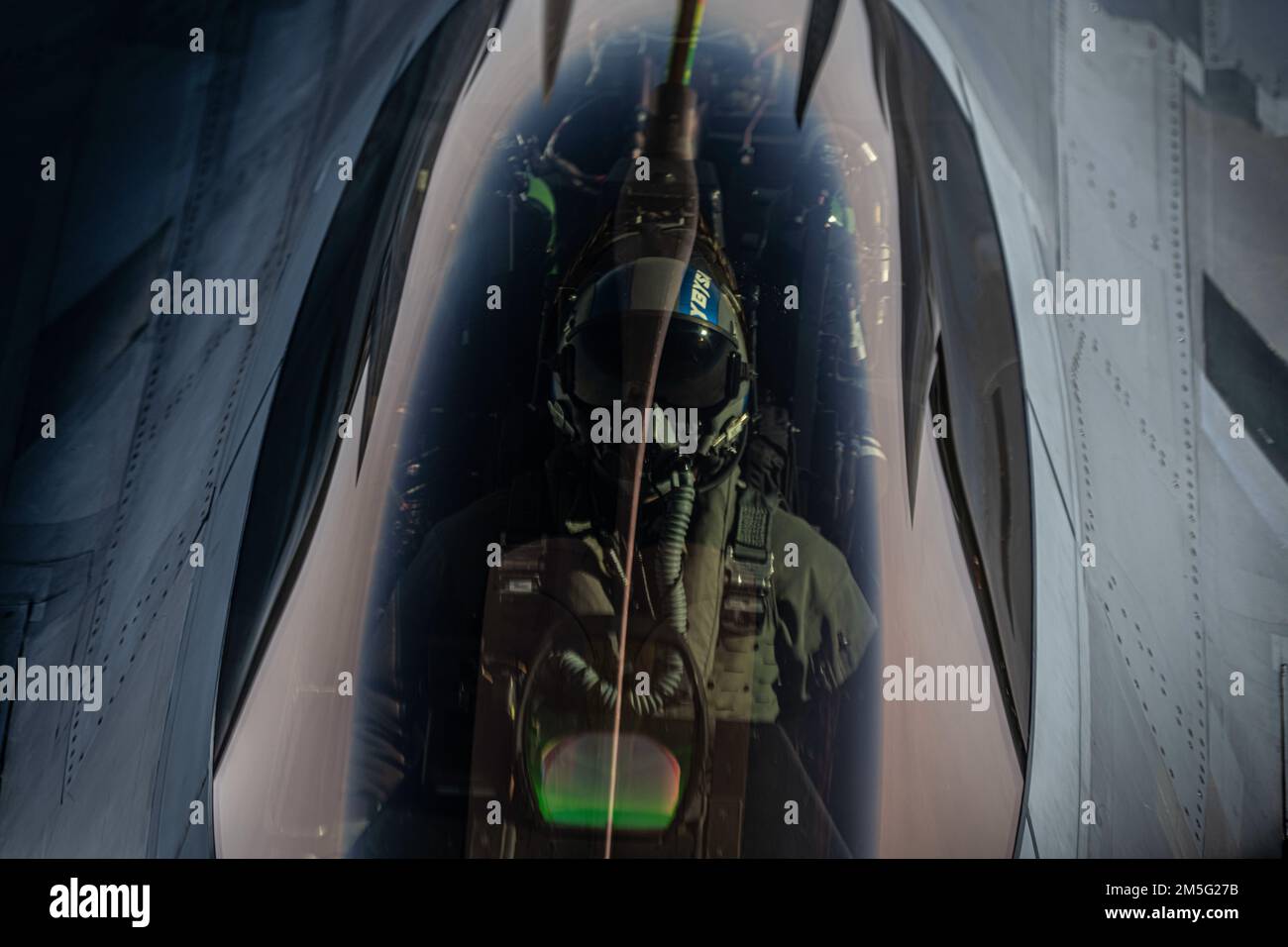 An F-22 Raptor, assigned to Alaska NORAD Region, is in-flight refueled ...