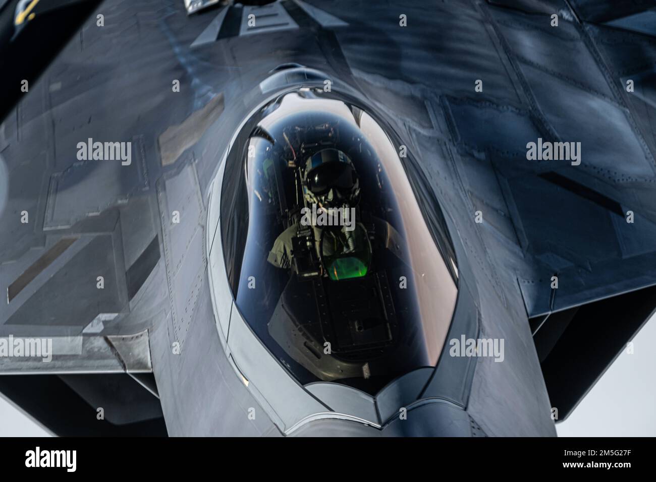 An F-22 Raptor, assigned to Alaska NORAD Region, is refueled by a KC ...