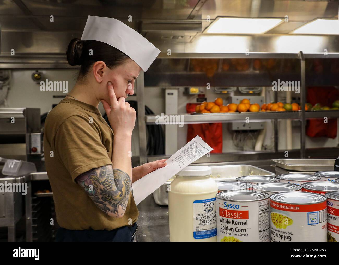 ATLANTIC OCEAN (March 16, 2022) – Culinary Specialist 3rd Class Alexandria Martinez reviews a ...