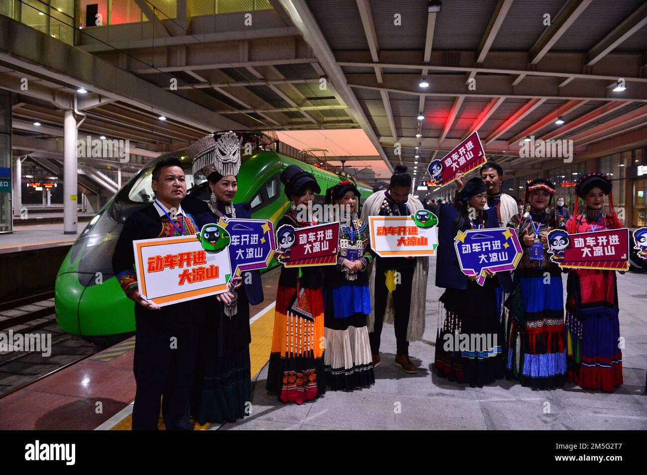 People pose for a photo at the Chengdu South Railway Station in Chengdu ...