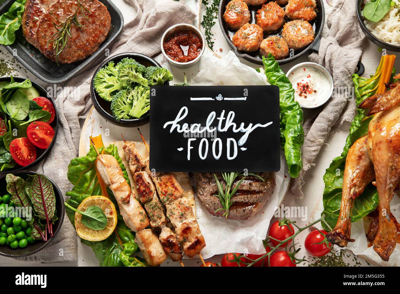 Various types of healthy cooked meat - beef, pork, chicken on a light ...