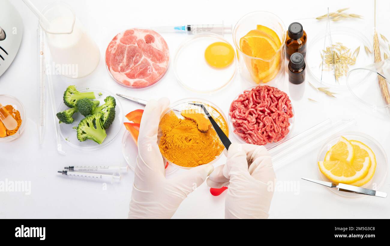 Work food quality control expert inspecting specimens of groceri hi-res stock photography and ...