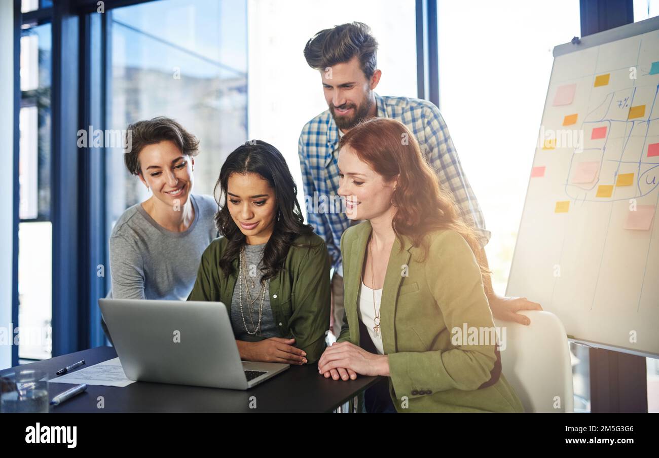 Group business colleagues looking laptop hi-res stock photography and ...