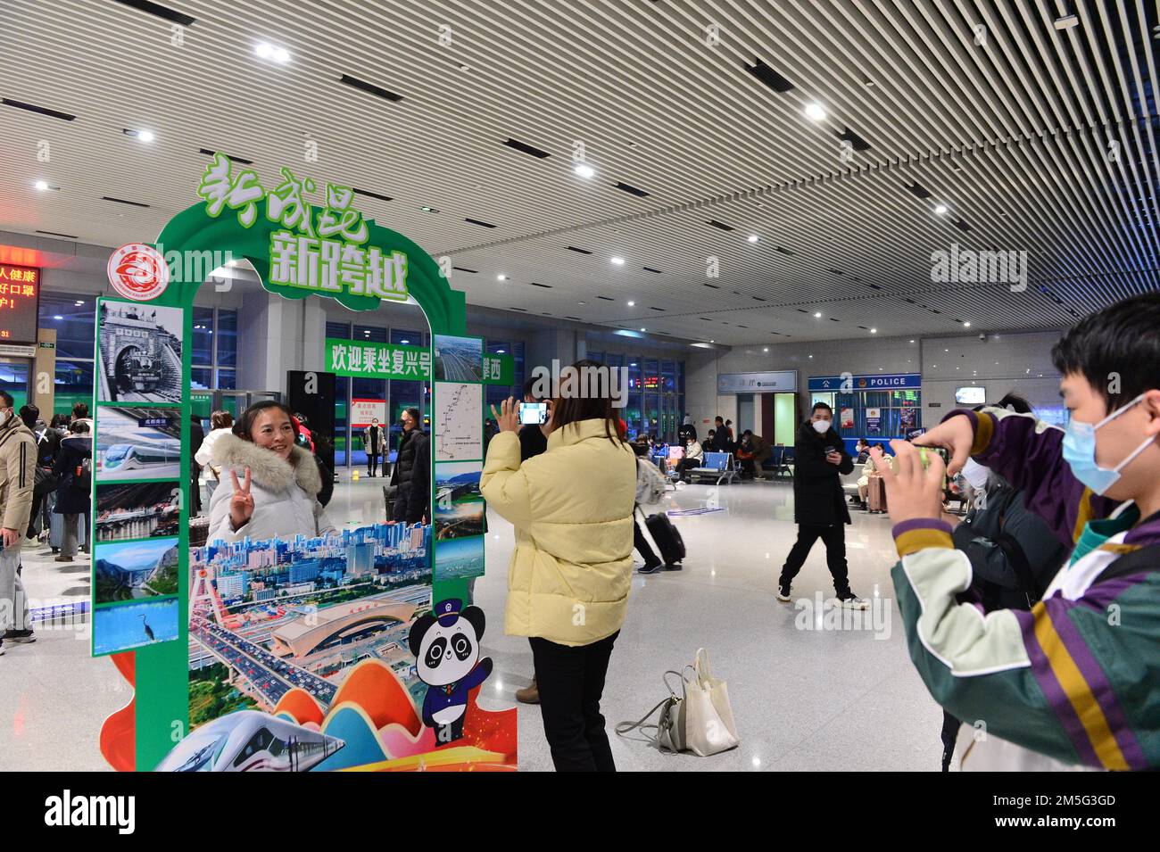 People pose for a photo at the Chengdu South Railway Station in Chengdu ...
