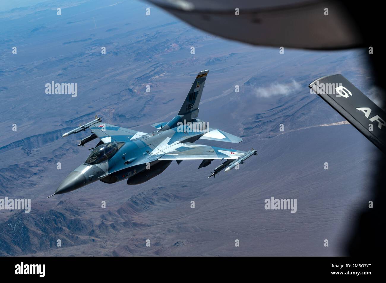 An F-16 Fighting Falcon, assigned to the 64th Aggressor Squadron ...