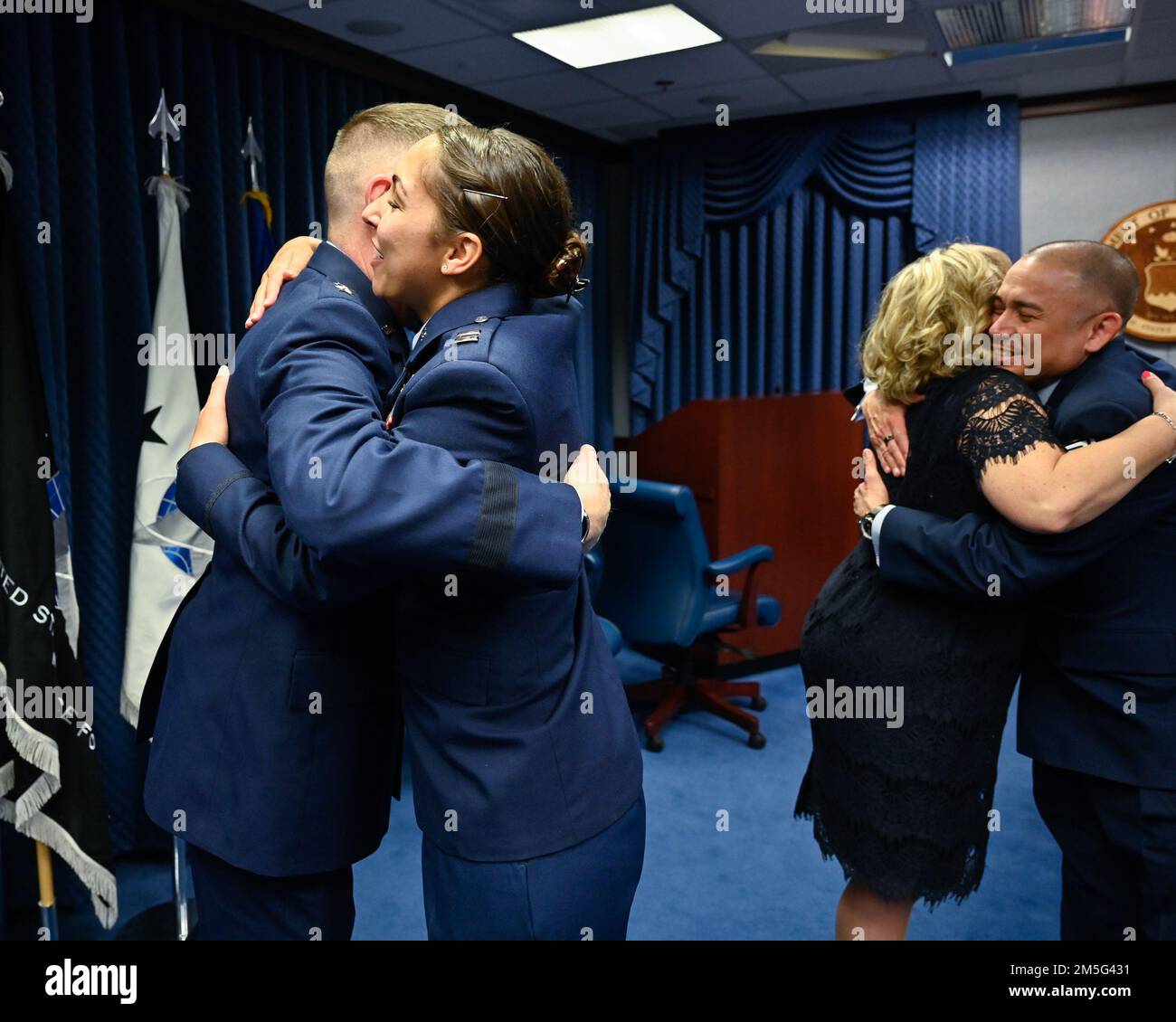 A colleague hugs Maj. Gen. Shawn Bratton after his promotion to major ...