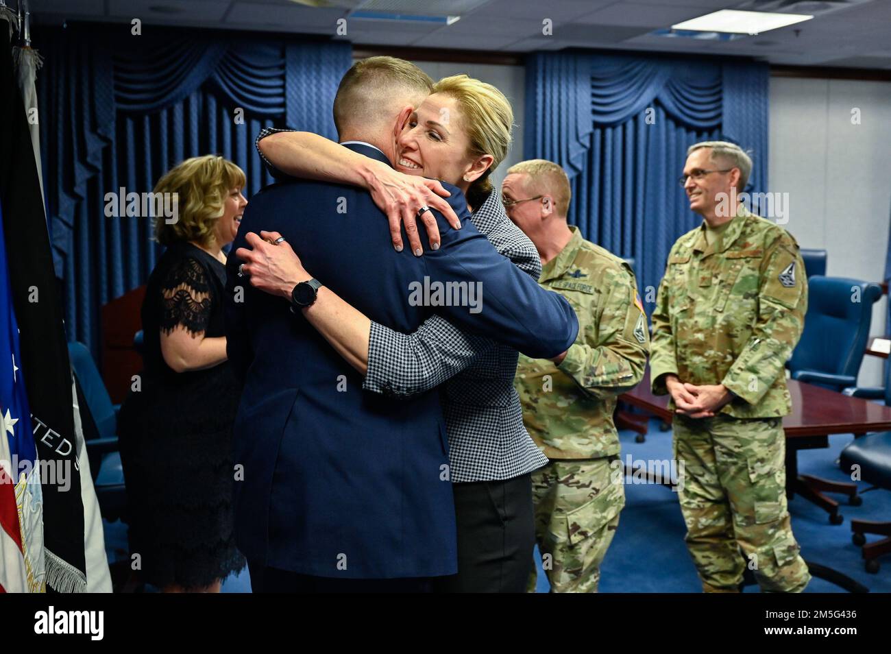 A colleague hugs Maj. Gen. Shawn Bratton after his promotion to major ...