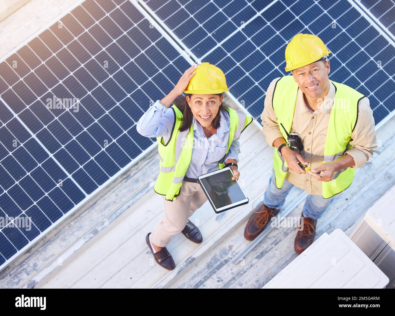 Solar panels, digital tablet and top view of team doing maintenance ...