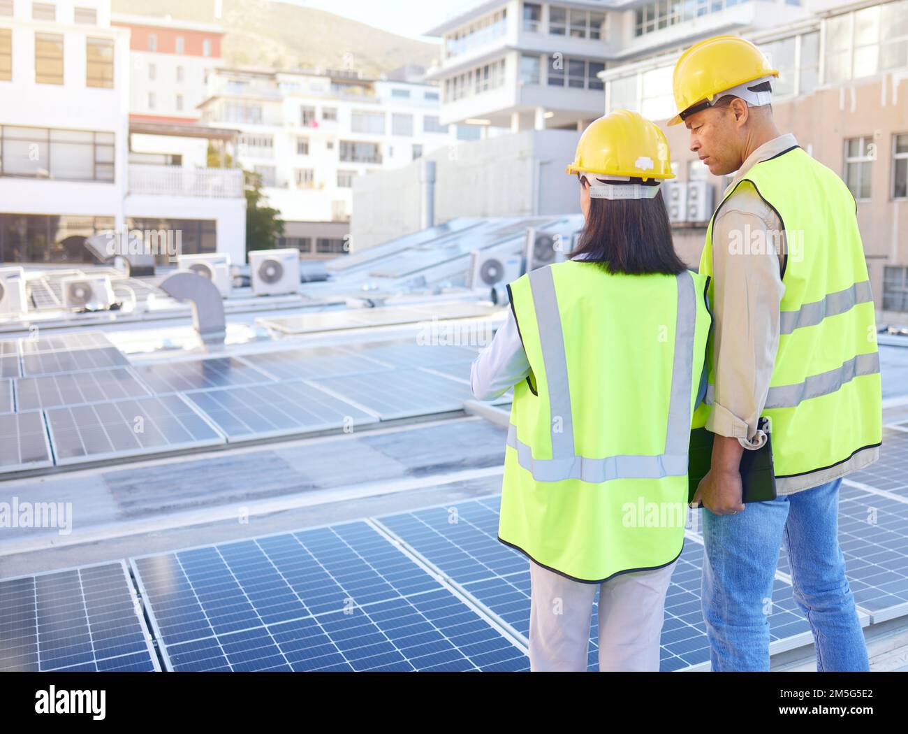 Engineer, back or woman with man, solar energy or sustainable power ...