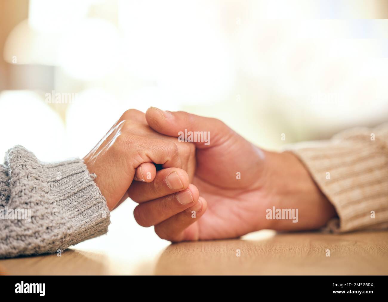 Love, support or couple holding hands with hope, trust and faith in a ...