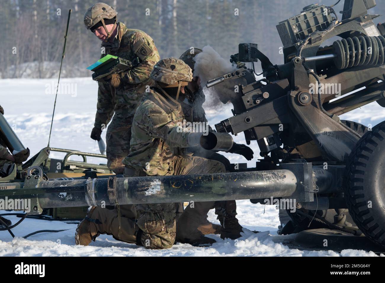 U.S. Army paratroopers assigned to Bravo Battery, 2nd Battalion, 377th Parachute Field Artillery ...