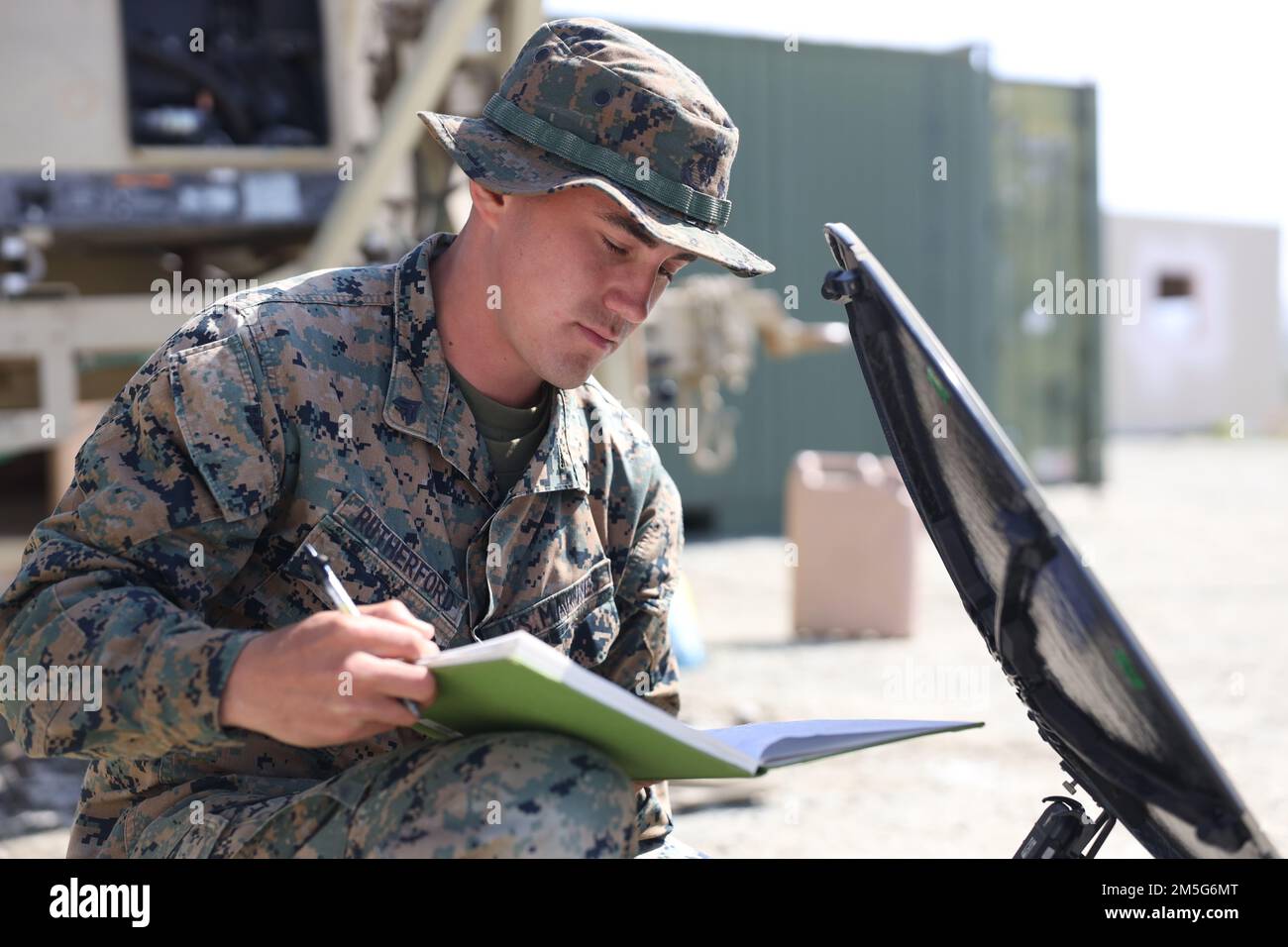 U.S. Marine Corps Cpl. Andrew Rutherford, a satellite transmissions ...