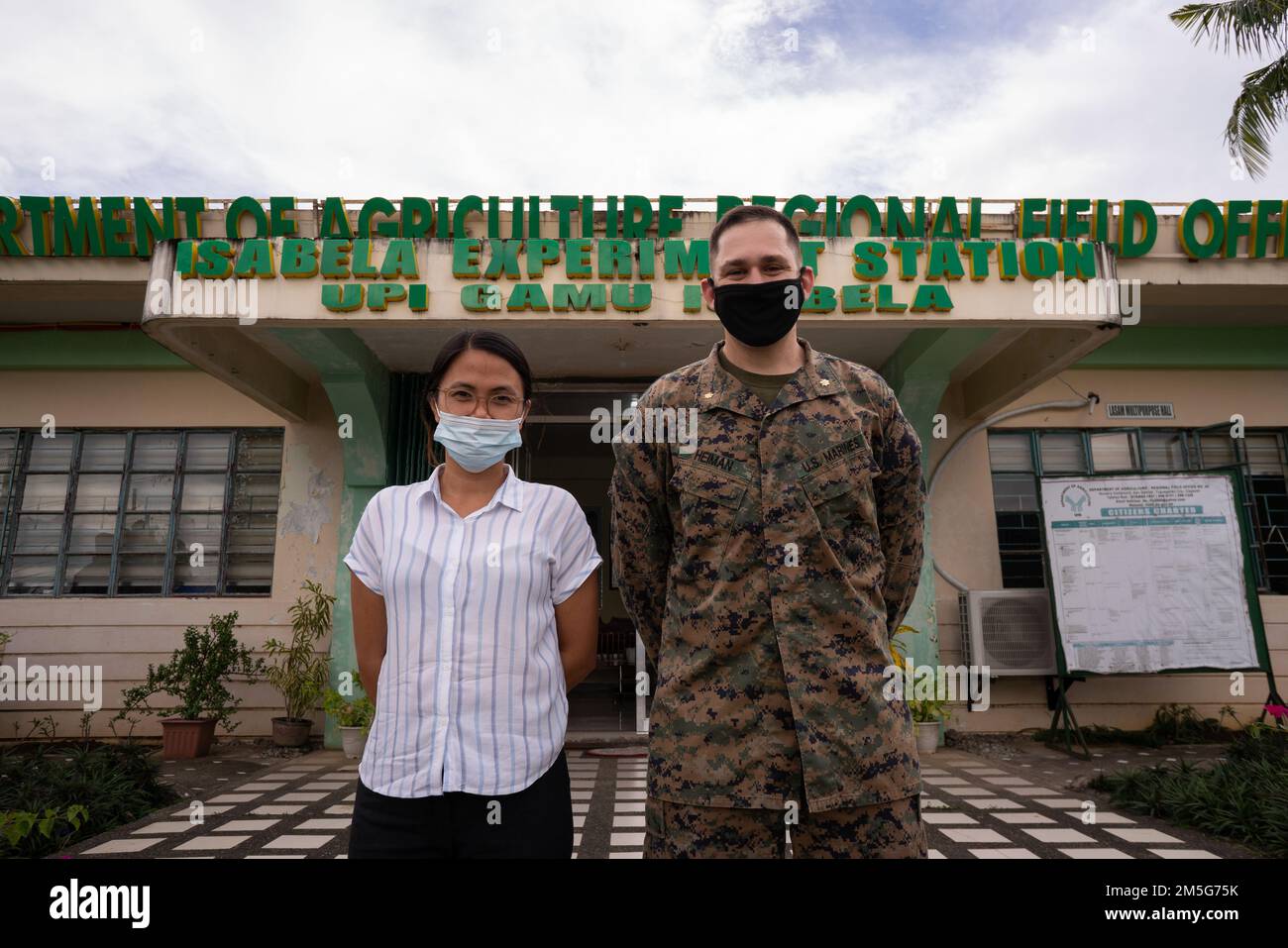 Jacqueline Gumiran (left), station manager of the Department of ...
