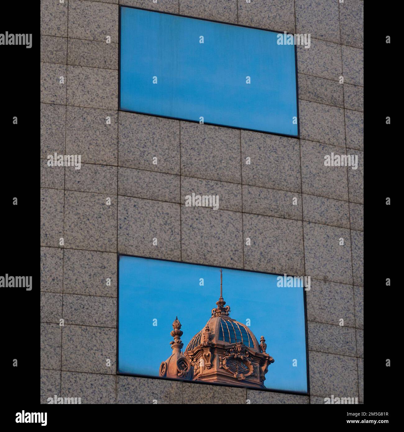 A vertical shot of the church of Santa Maria Della Salute reflecting on ...