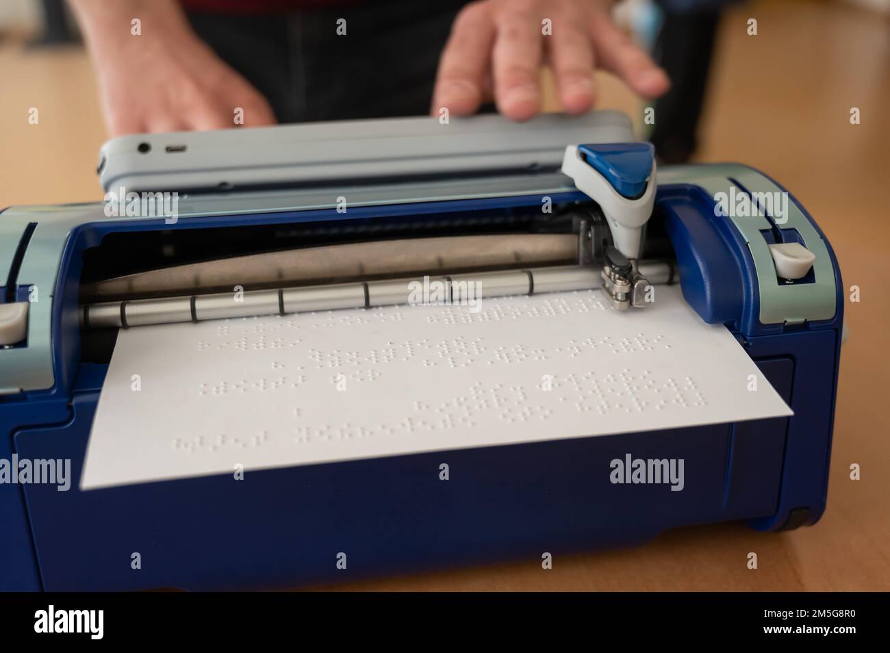 Blind man using braille typewriter Stock Photo - Alamy