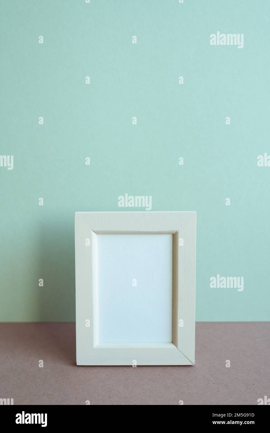 Blank picture frame on table. mint wall background. copy space Stock ...
