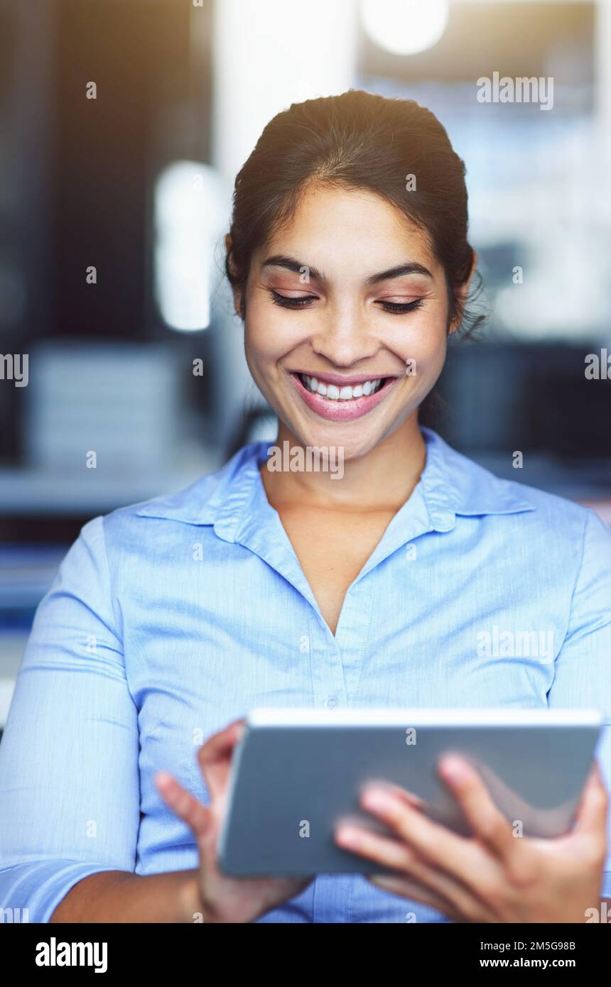 Wireless technology always gives her a reason to smile. a happy young ...
