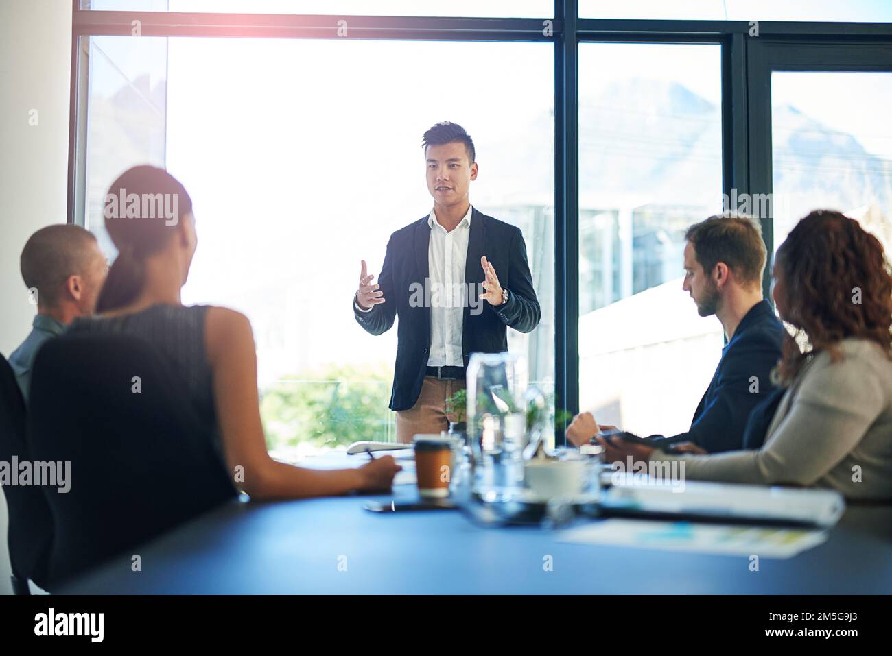 You make a good point. a group of businesspeople meeting in the ...