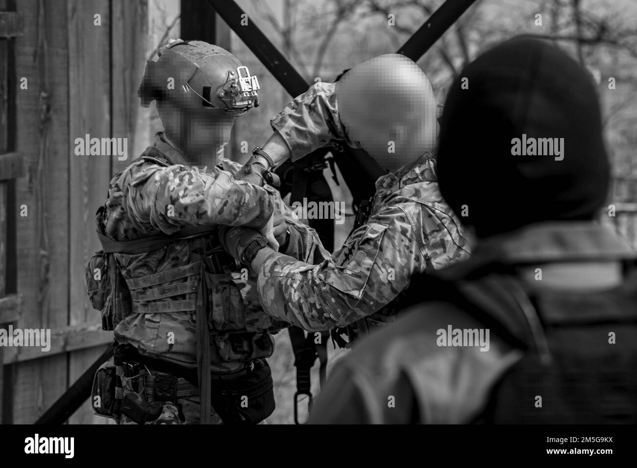A member of 10th Special Forces Group assists with downgrading ...