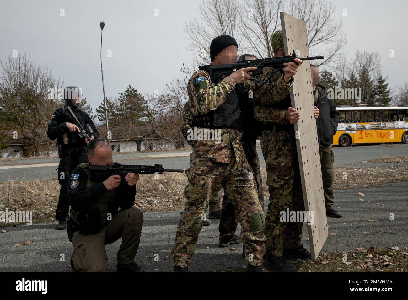 Members of Kosovo Special Intervention Unit demonstrate combat raiding ...