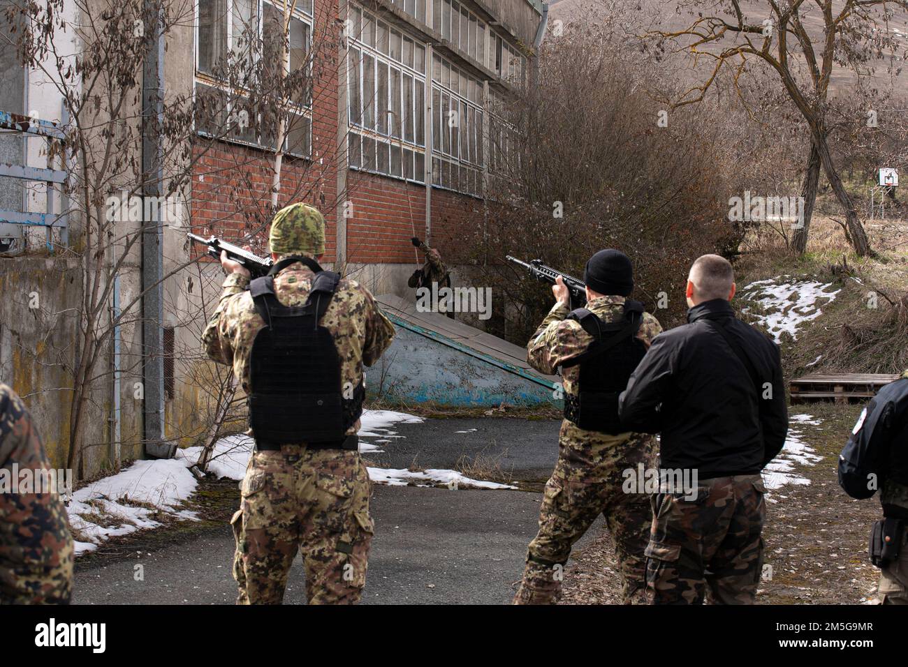 Members of Kosovo Special Intervention Unit demonstrate combat raiding ...