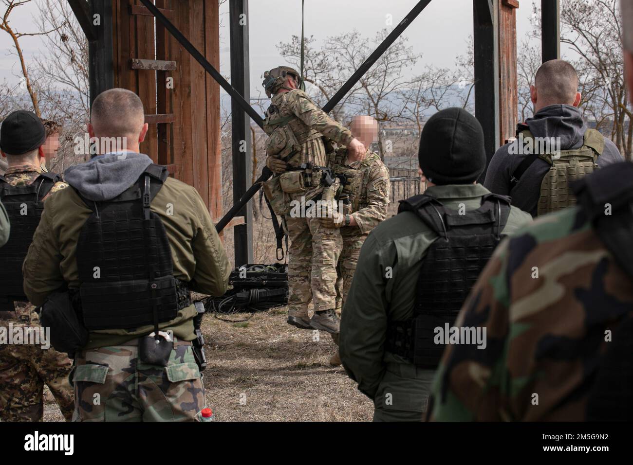 A member of 10th Special Forces Group repel off a tower during a ...