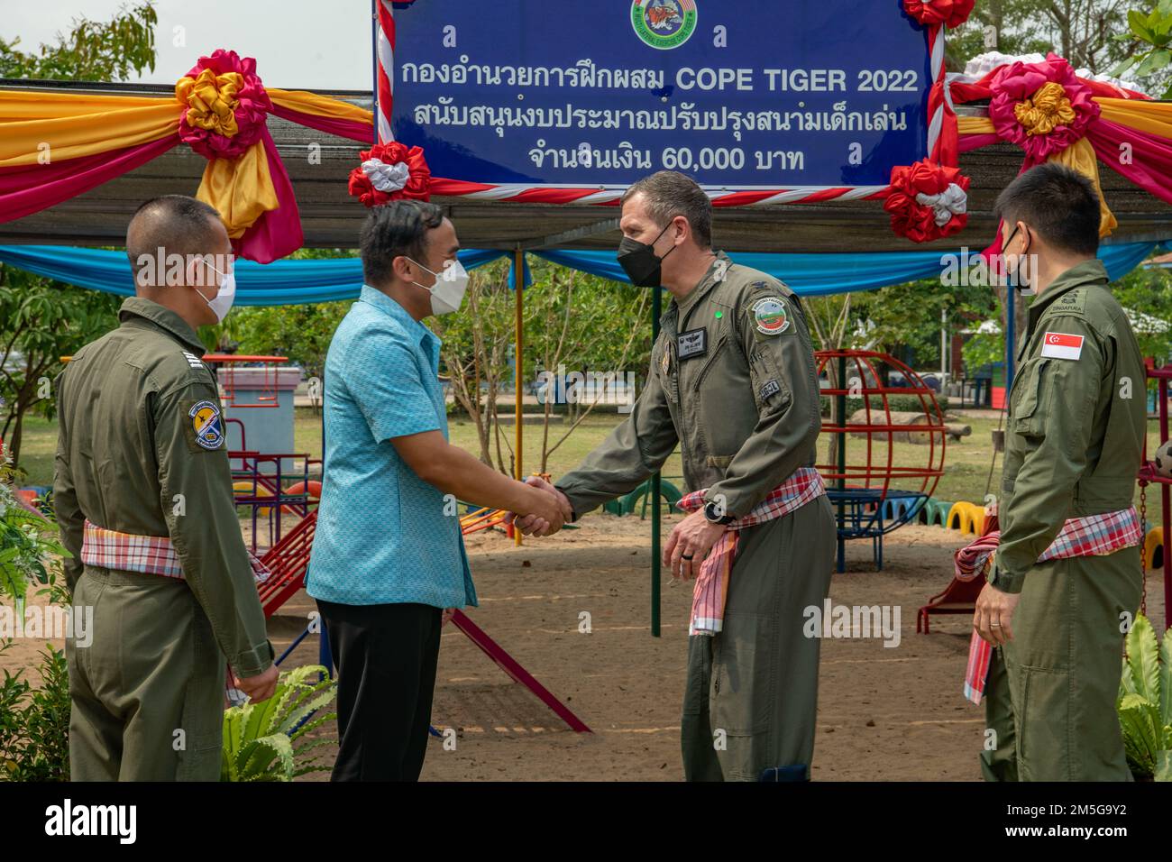 U.S. Air Force Col. John Gallemore, 8th Fighter Wing commander, greets ...