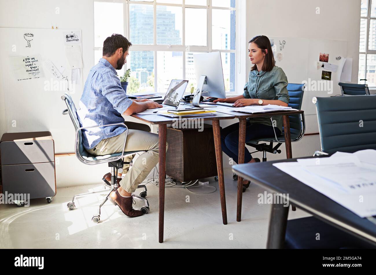 Working hard to turn their startup into a success. colleagues working ...