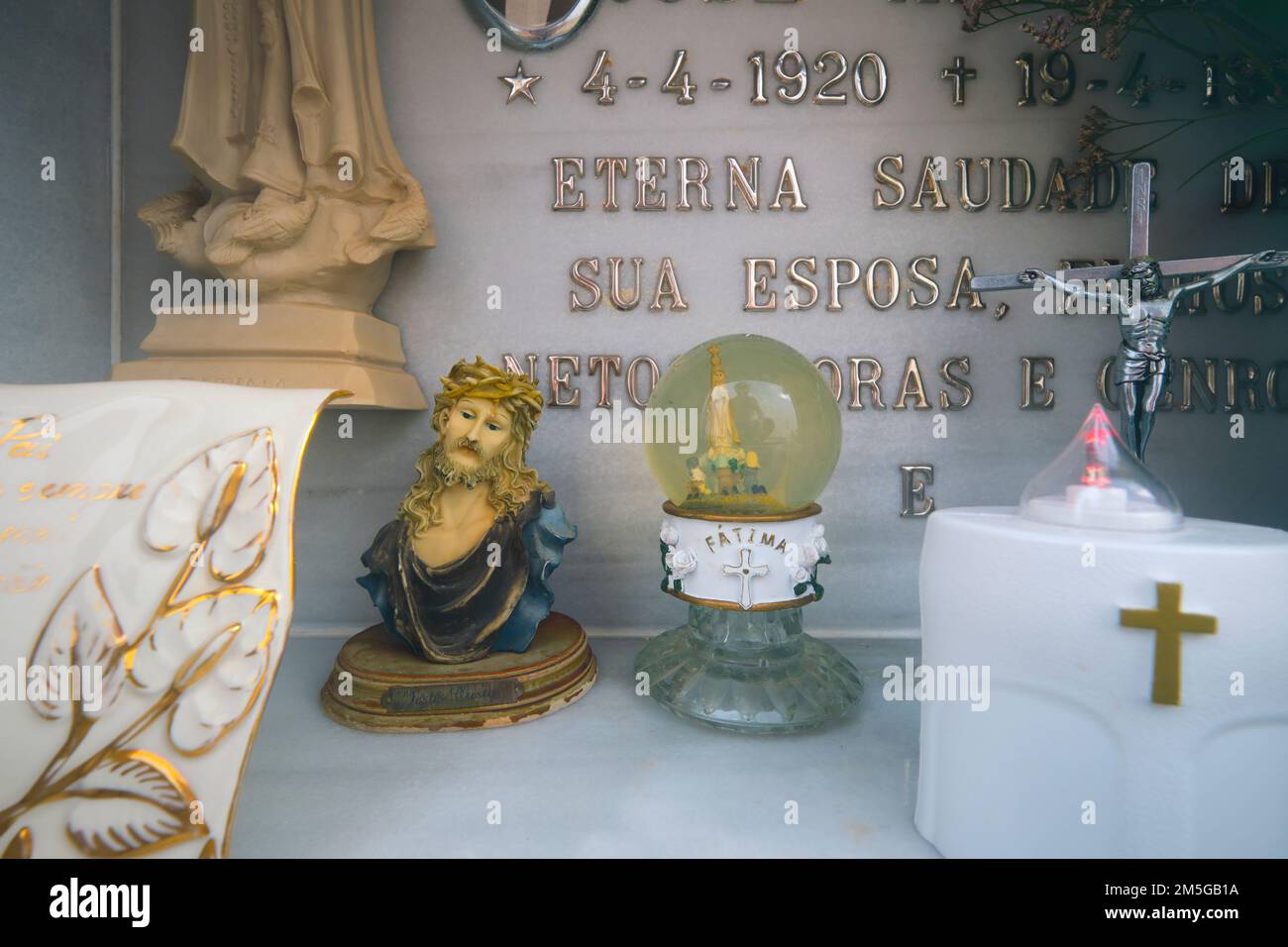 A Jesus sculpture and religious snowglobe, icon, relic, decorating a ...