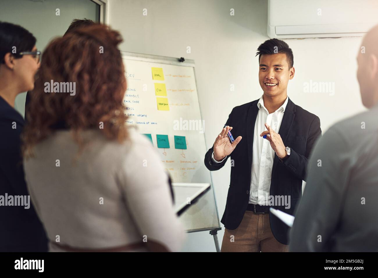 Asian person giving presentation hi-res stock photography and images ...