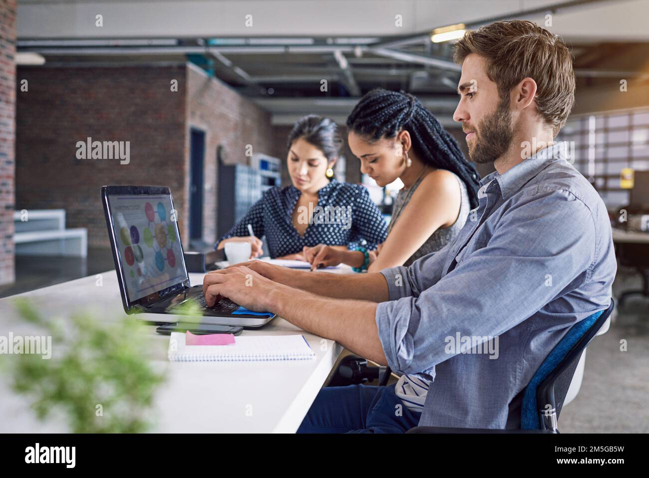 Crafting winning designs together. a group of young designers working ...