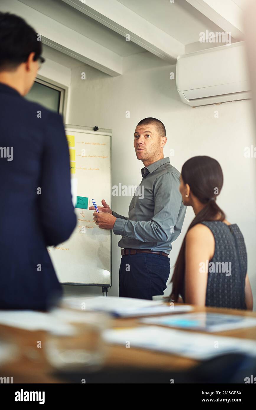 Group around whiteboard in office hi-res stock photography and images ...