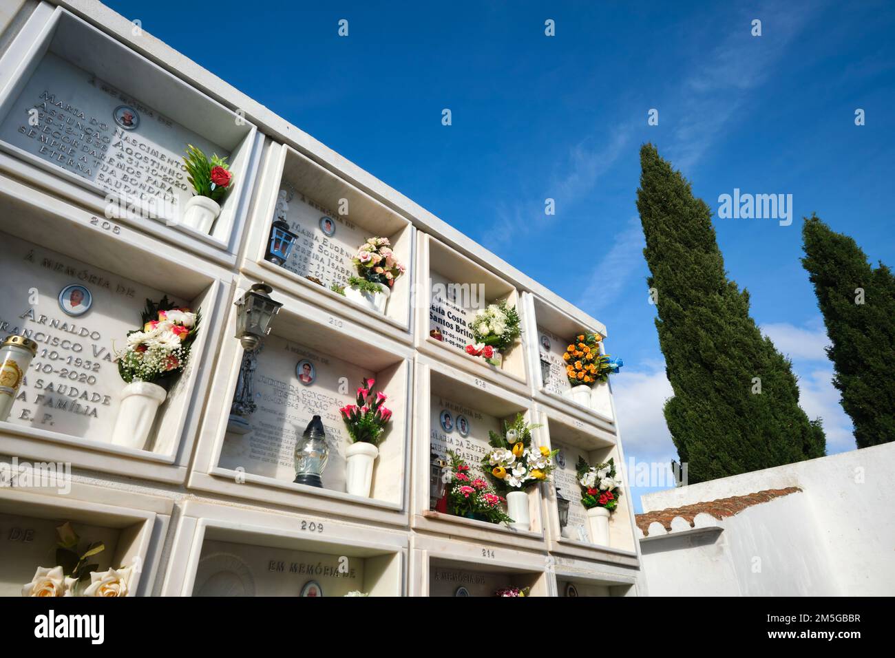 A view of some of the many flower decorated tombs at the Catholic ...