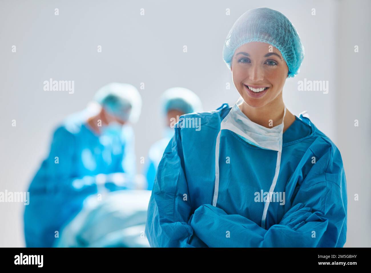 The surgery was a success. Portrait of a surgeon standing in an ...