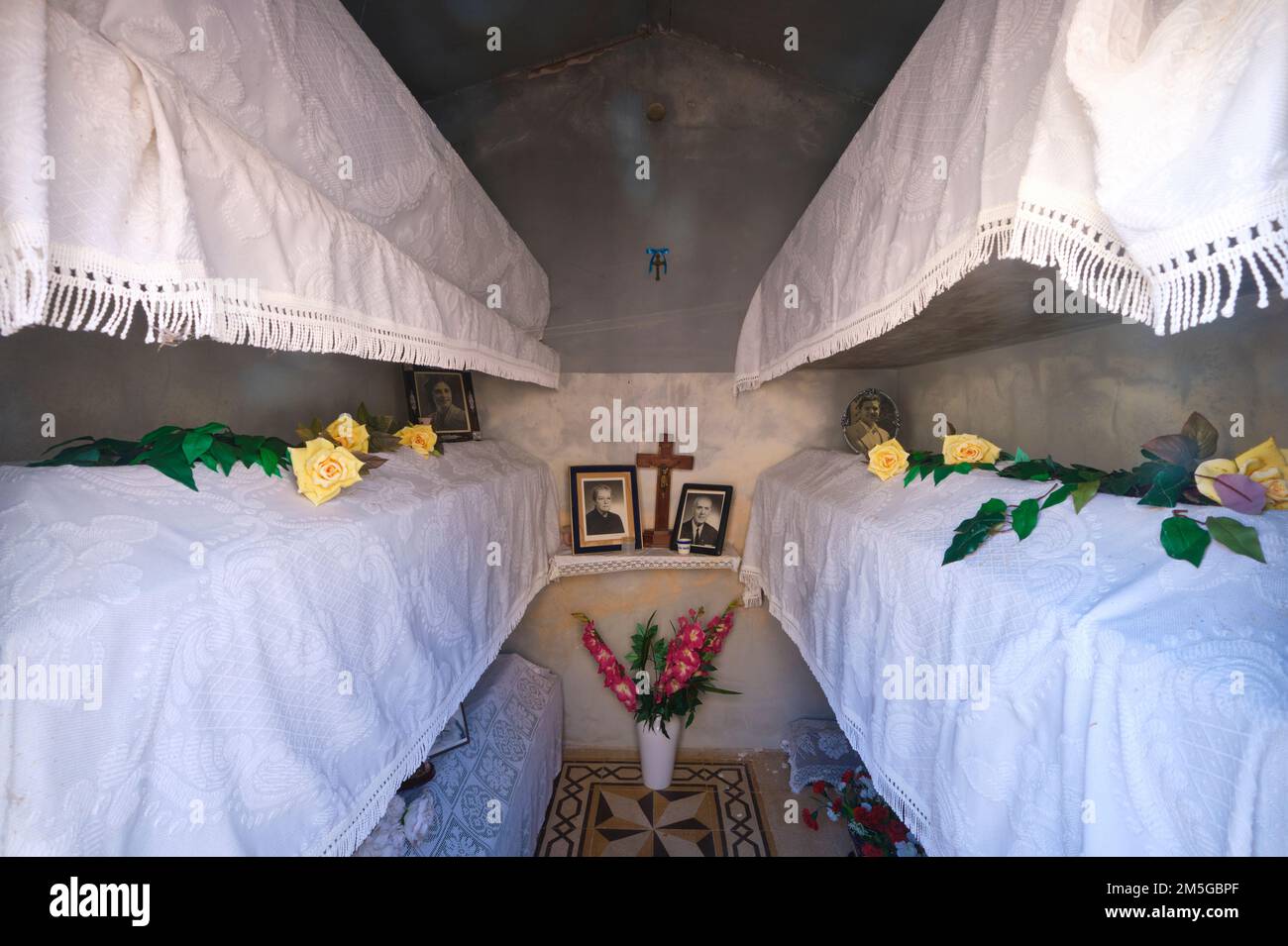 A view of various family members' coffins, caskets, stacked in their ...