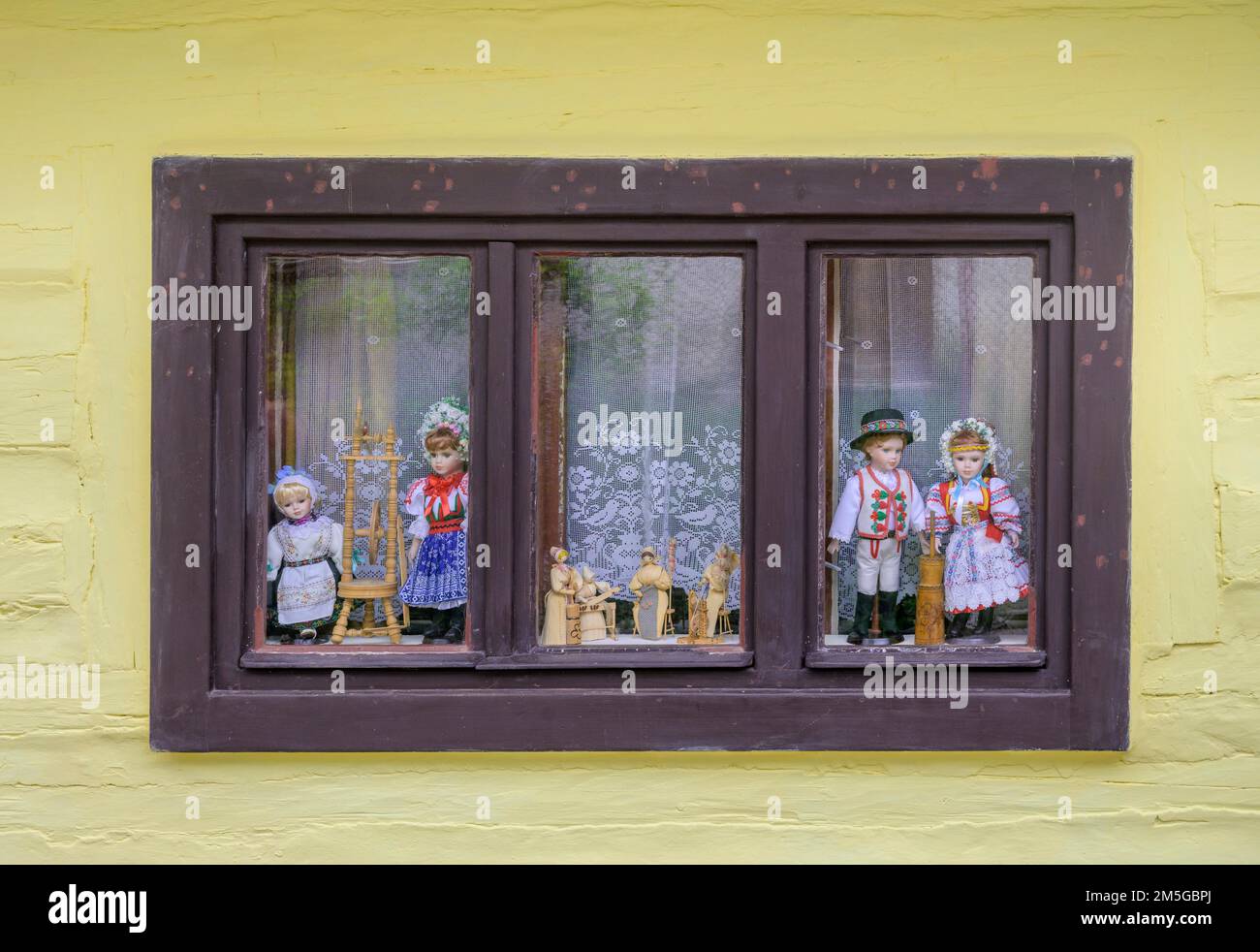 Window with traditional traditional costume dolls, Vlkolinec village ...
