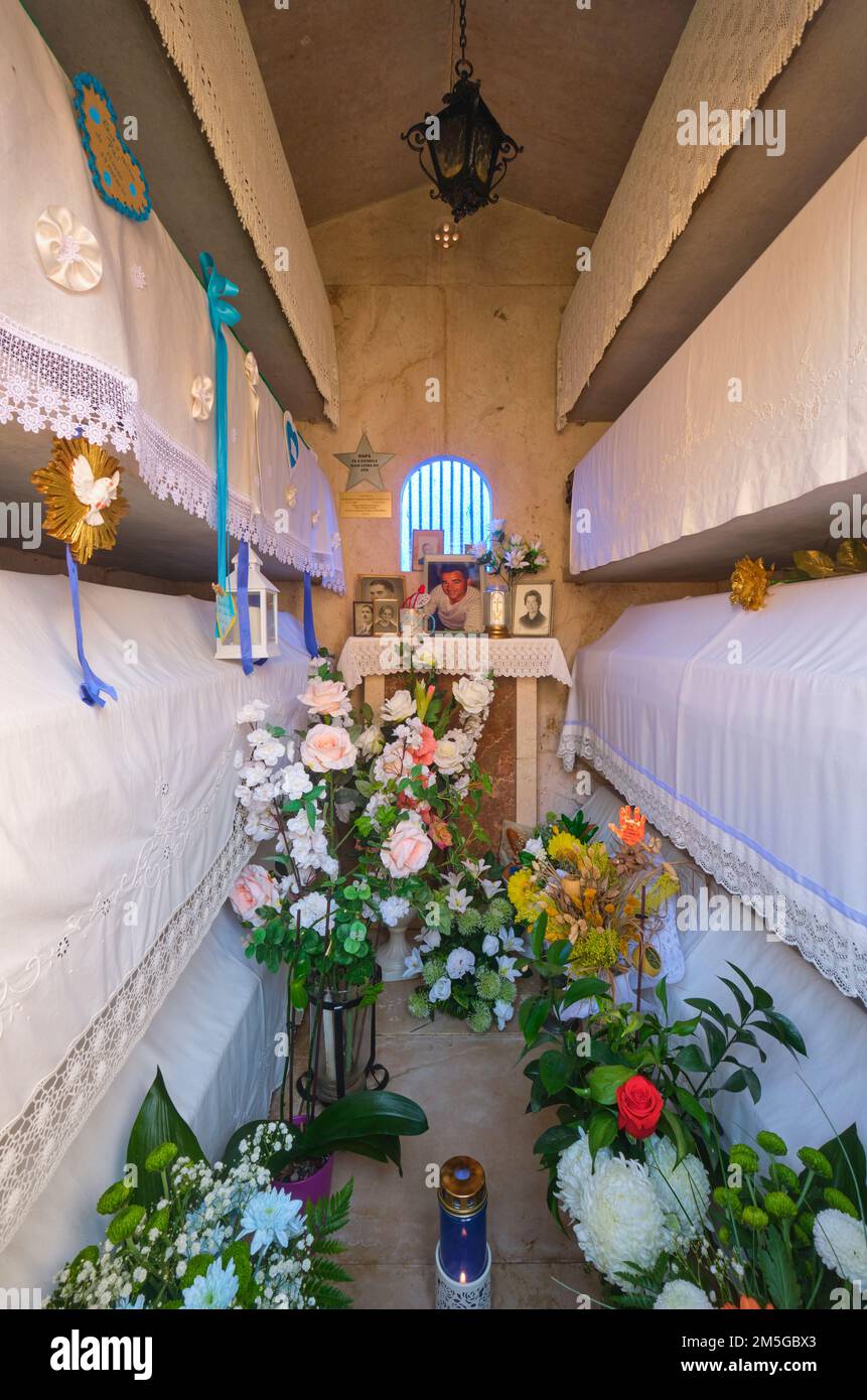 A view of various family members' coffins, caskets, stacked in their ...