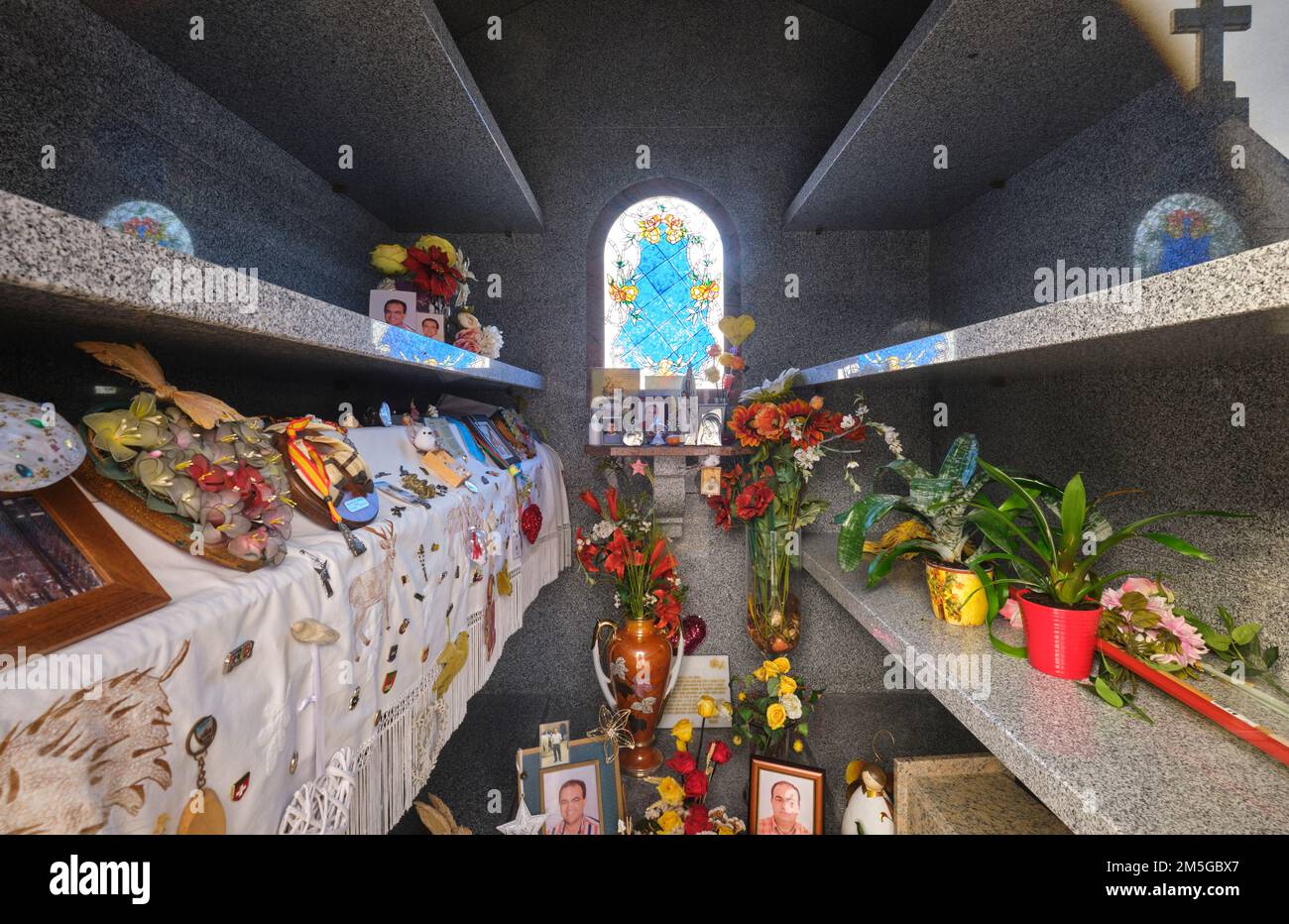 A view of various family members' coffins, caskets, stacked in their ...