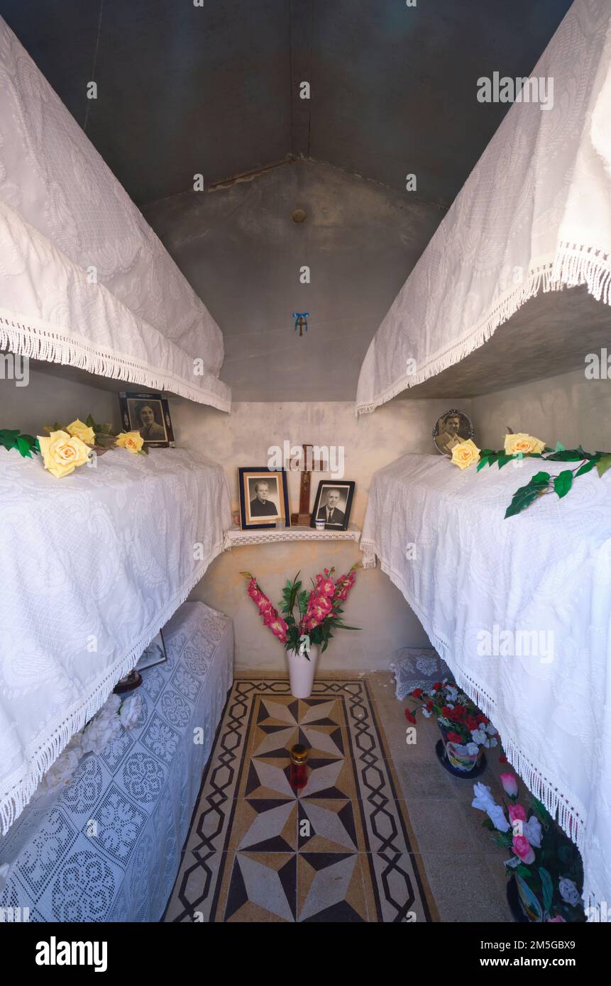 A view of various family members' coffins, caskets, stacked in their ...