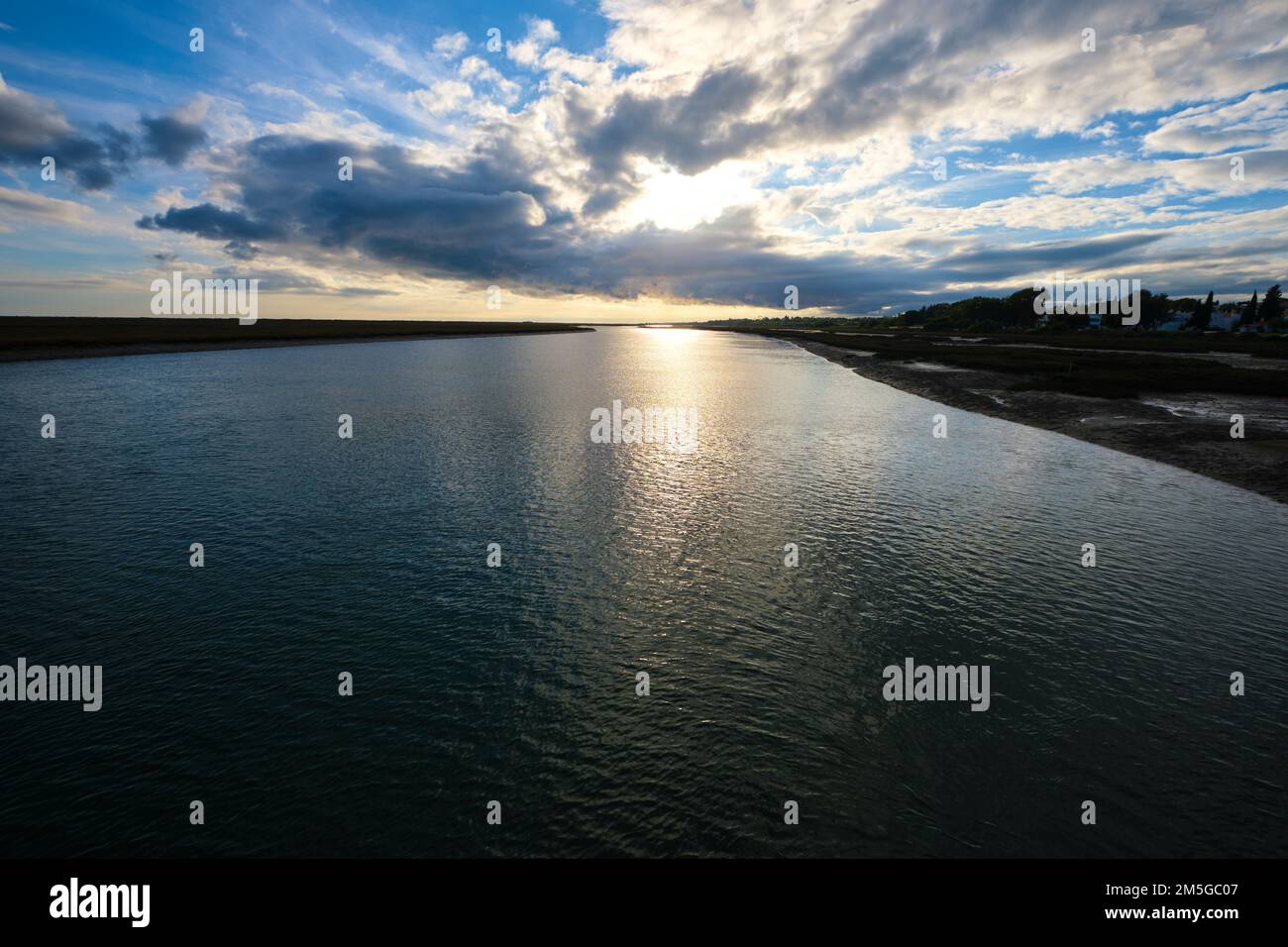 Sunset, dusk view of the waterway inlet on the way out to Barril beach ...