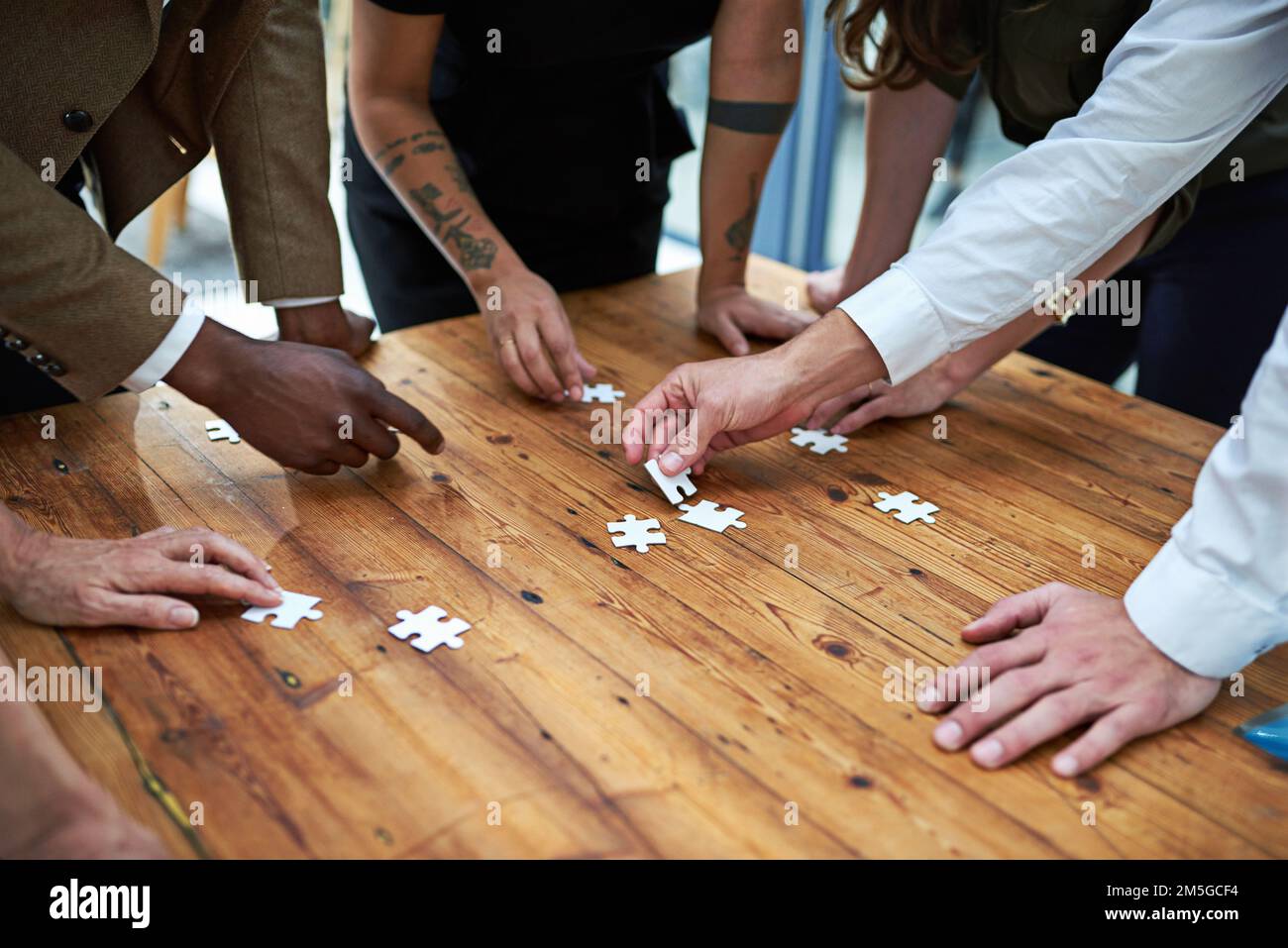 Putting the pieces in place. a group of unidentifiable businesspeople ...
