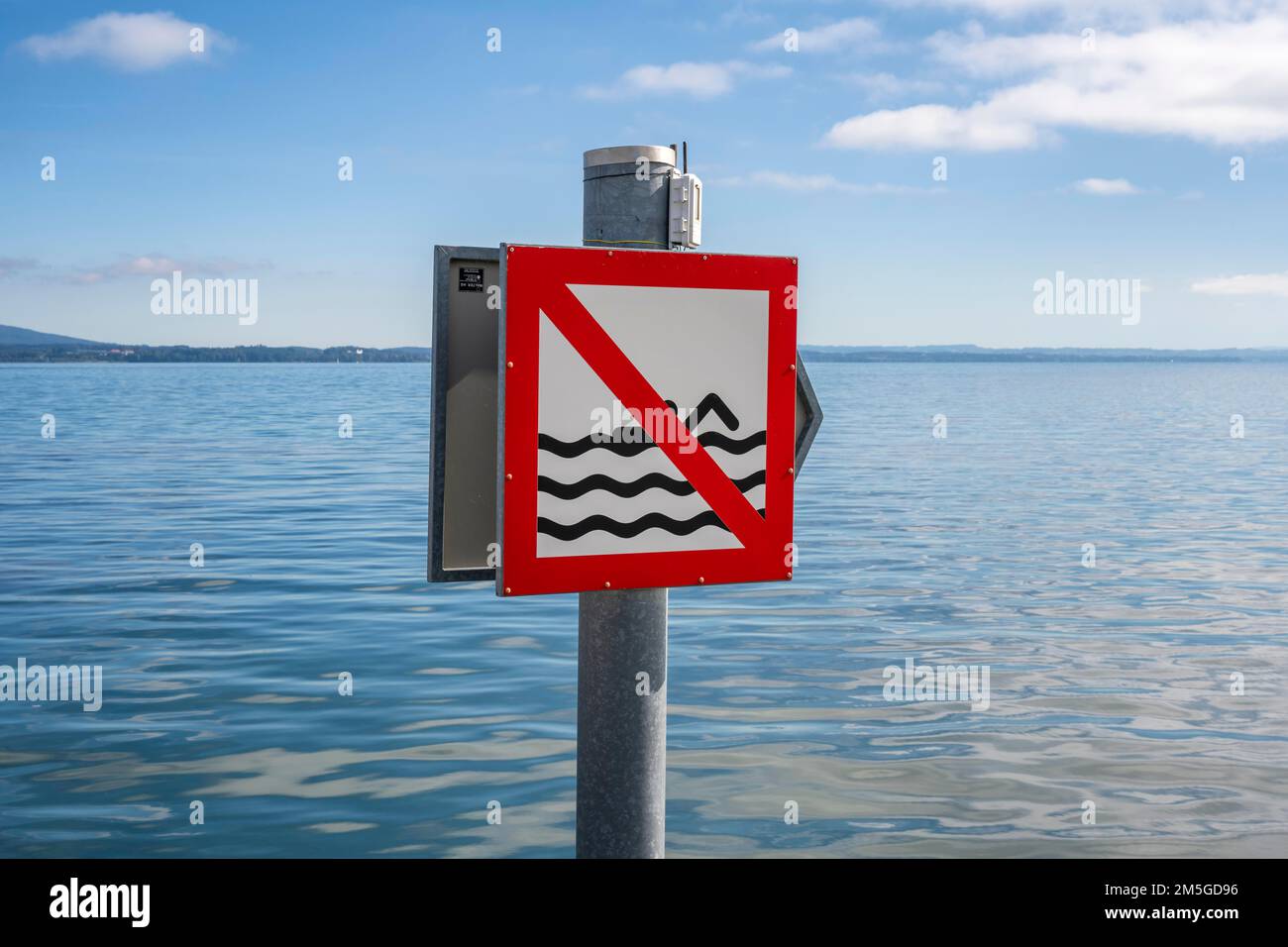 Prohibition sign with pictogram for bathing prohibition on the shore of ...