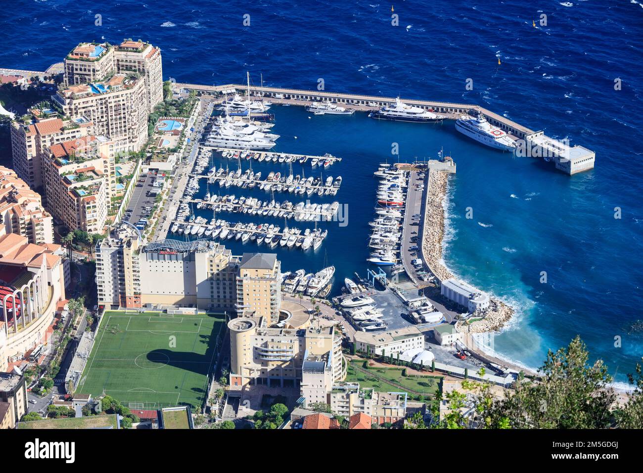 Port of Cap d'Ail, on the left Principality of Monaco with the high ...