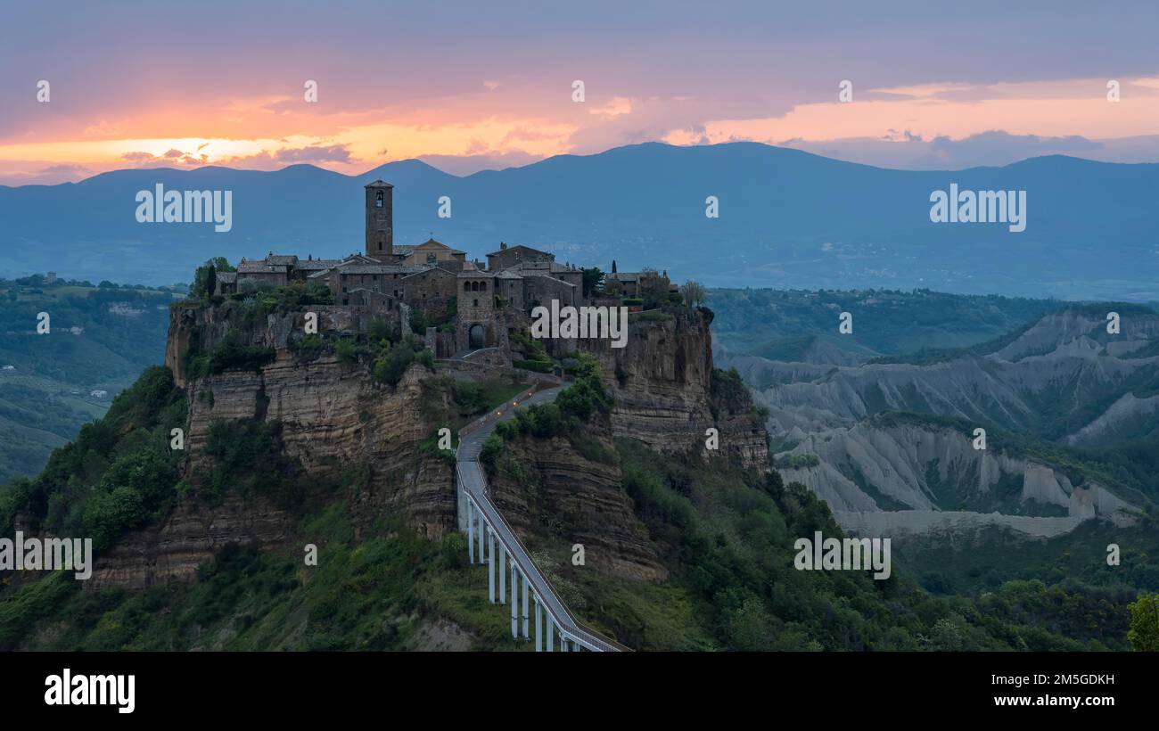 The mountain village of Civita di Bagnoregio in hilly landscape at ...