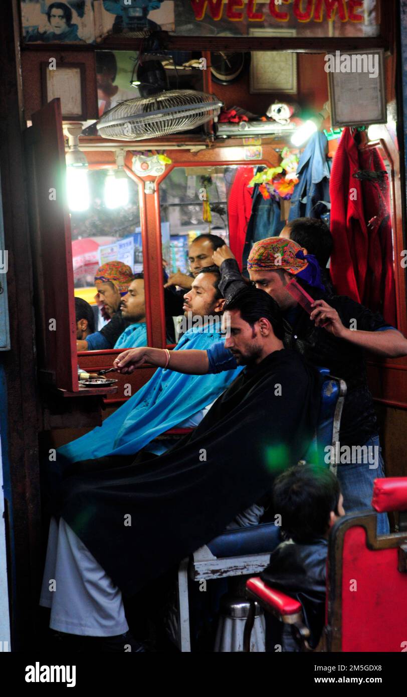 haircut at a local barber shop in Kolkata, India Stock Photo - Alamy